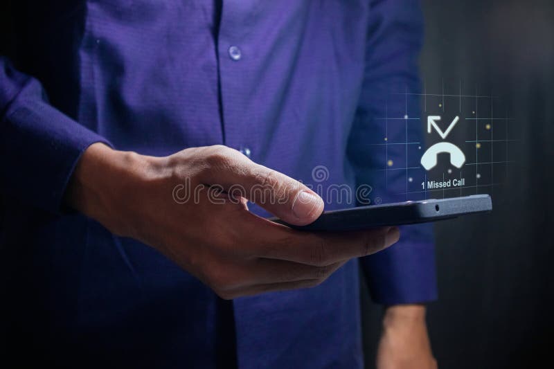 Man Using a Mobile Phone with with Missed Call Notification on the ...