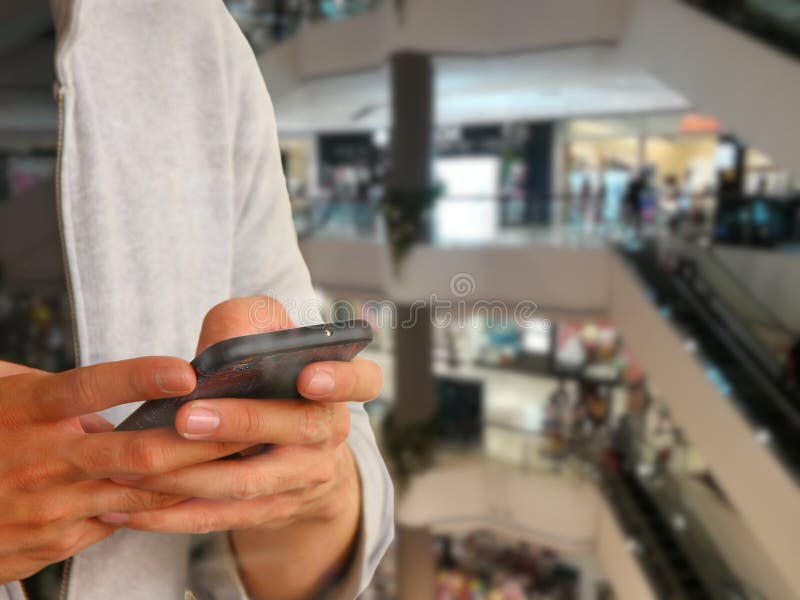 Man Using Mobile Phone Payment in Department Store Stock Photo - Image ...