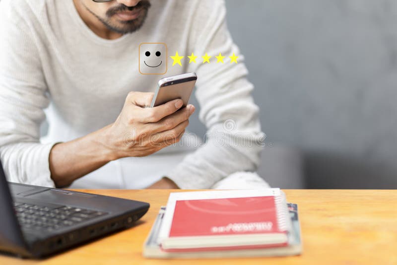 Man Using Mobile Phone with Pressing Happy and Five Stars Icon at ...