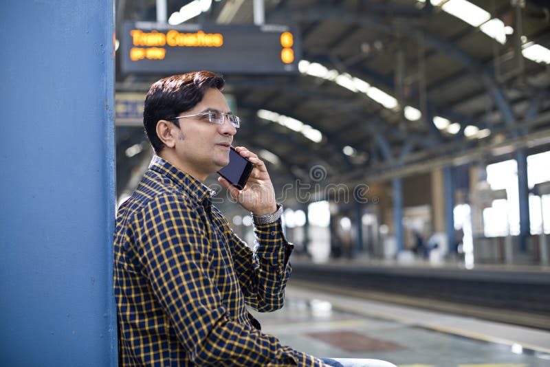 Man Using Mobile Phone at Railroad Station Platform Stock Photo - Image ...
