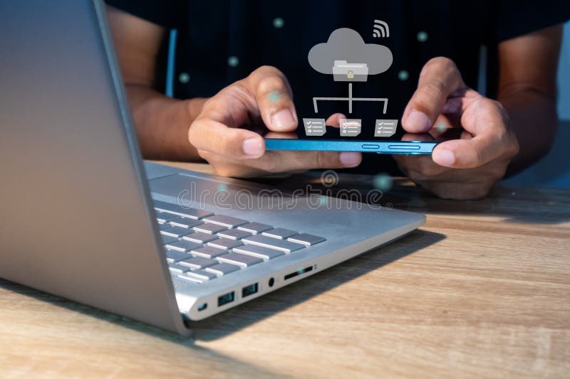 A Man Using Mobile Smartphone To Manage Files or Documents with Cloud ...