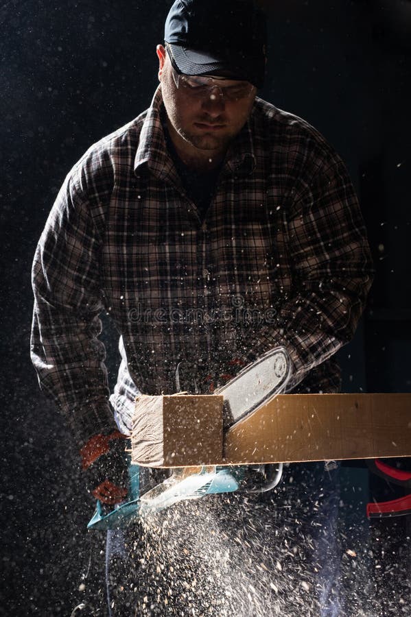 Man Using Modern Electric Circular Saw in the Workshop Stock Photo ...