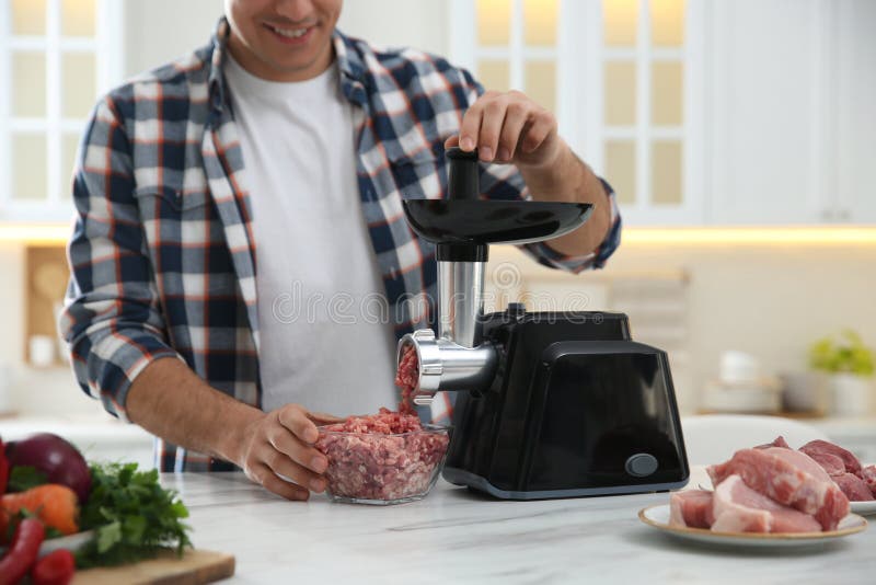 Man Using Modern Meat Grinder in Kitchen Stock Image - Image of happy ...