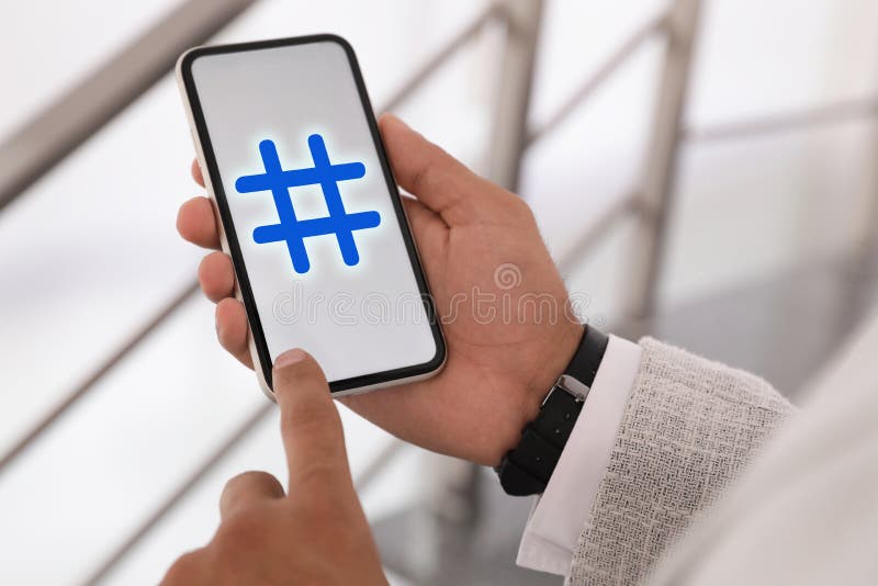 Man Using Modern Smartphone with Hashtag Symbol on Screen, Closeup ...