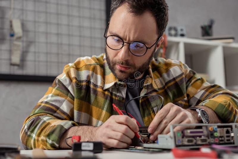 Man Using Multimeter while Fixing Broken Computer Stock Image - Image ...
