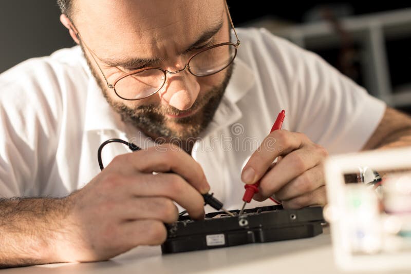 Man Using Multimeter while Testing Hard Disk Drive Stock Image - Image ...
