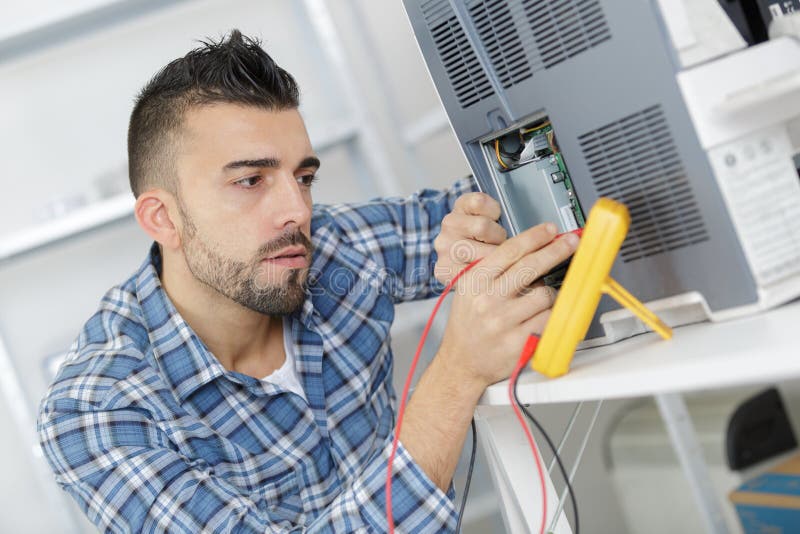 Man Using Multimeter To Test Electrical Appliance Stock Photo - Image ...