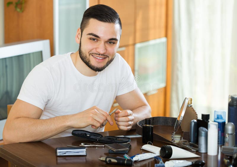 Man using nail file stock image. Image of person, house - 64013481