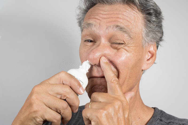 Man Using a Nasal Spray for His Nose Stock Image - Image of allergy ...