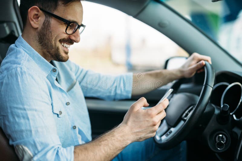 Handsome Man Using Navigation System while Driving Car Stock Photo ... Handsome Man Using Navigation System while Driving Car Stock Photo ...