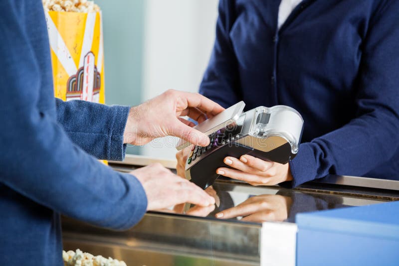Man Using NFC Technology at Concession Counter Stock Image - Image of ...