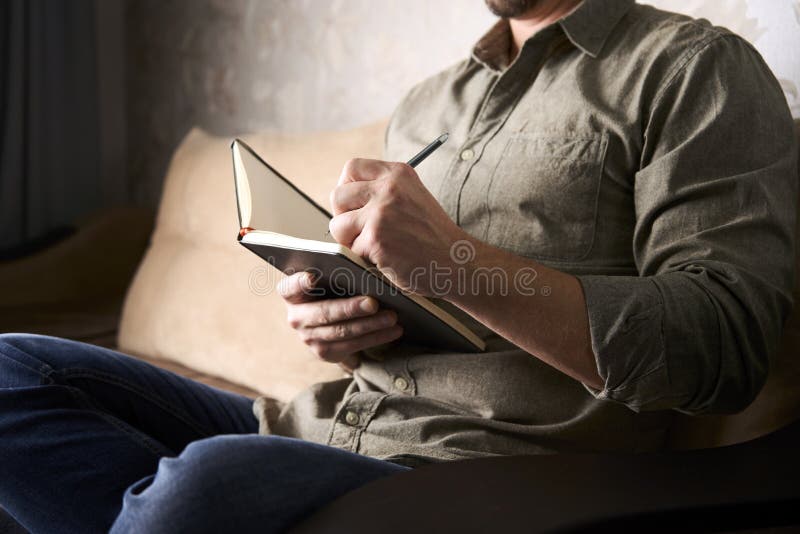 Man Using on Notebook and Working on Laptop Computer Stock Photo ...