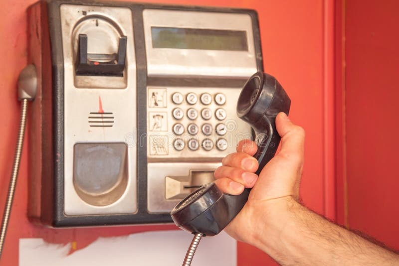Man Using Old Public Phone on the City Street Stock Photo - Image of ...