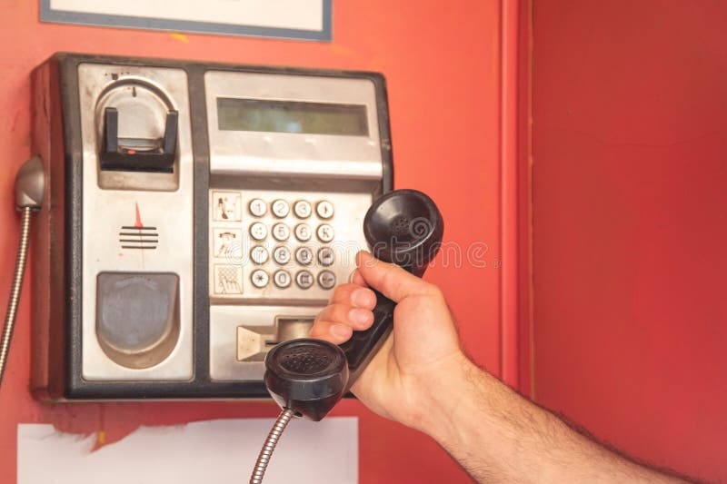 Man Using Old Public Phone on the City Street Stock Image - Image of ...