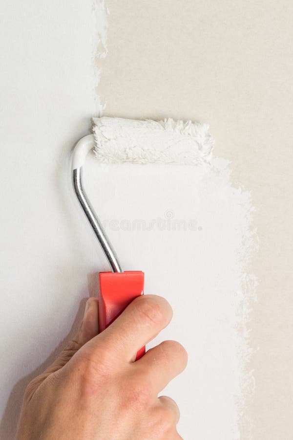 Man Using Paint Roller on the Wall Stock Photo - Image of strong, home ...