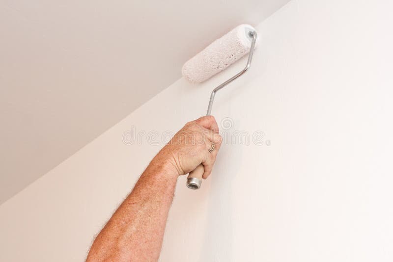 Man Using Paint Roller on White Wall Stock Photo - Image of roller ...