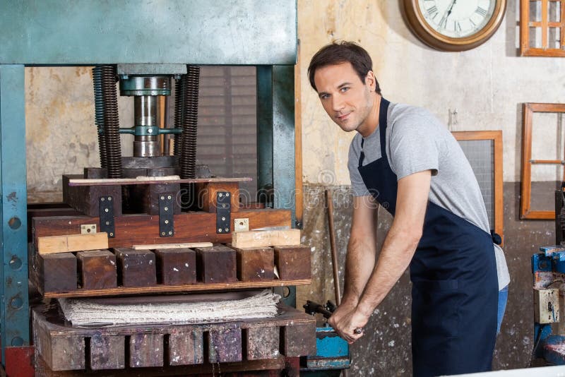 Man Using Paper Press Machine in Factory Stock Image - Image of ...