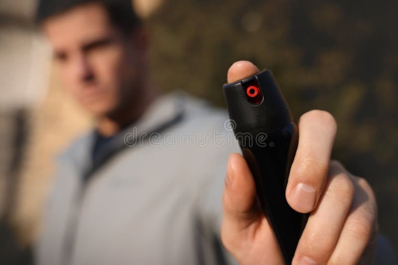 Man Using Pepper Spray Outdoors, Focus on Hand. Space for Text Stock ...