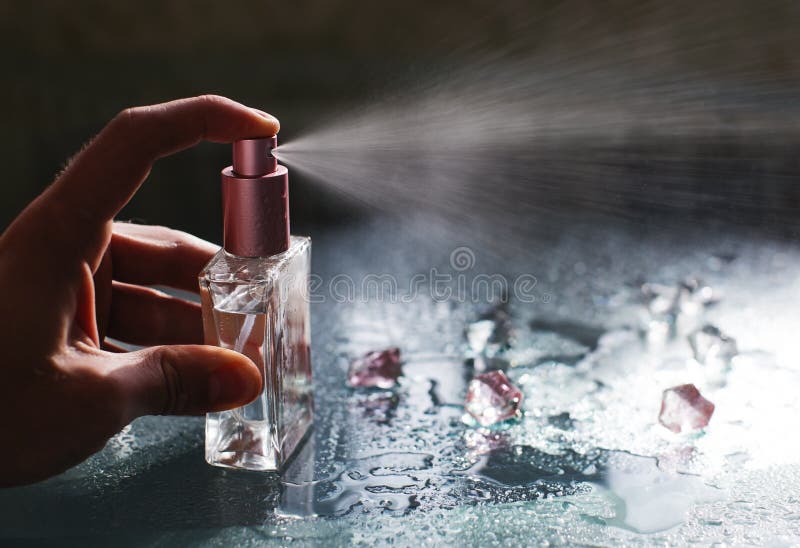 Man using perfume stock photo. Image of hold, beauty - 60642762