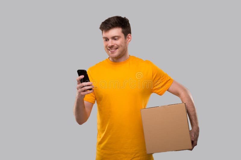 Man Using Phone with Box in Hands. Delivery Man with Box Stock Image ...