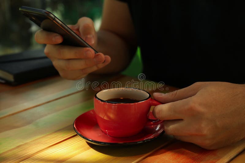 Man Using Phone and Drink Coffee in Restaurant Stock Image - Image of ...