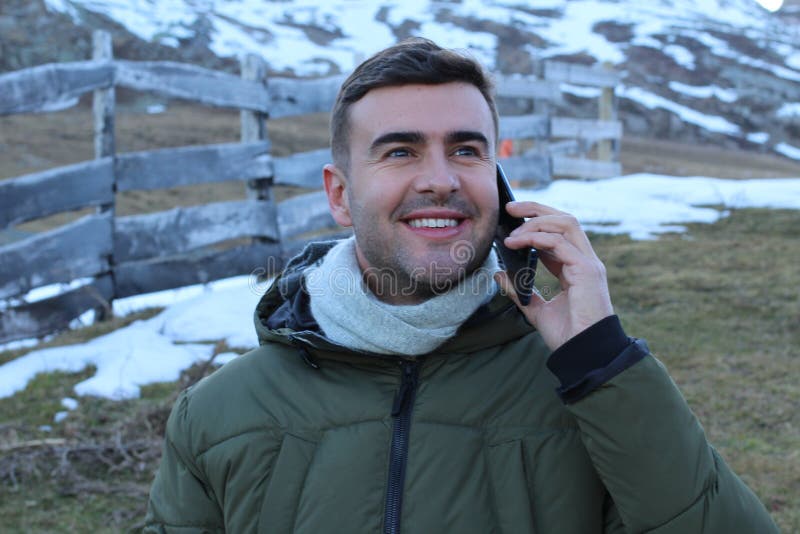 Man using phone in nature stock image. Image of holding - 203730891