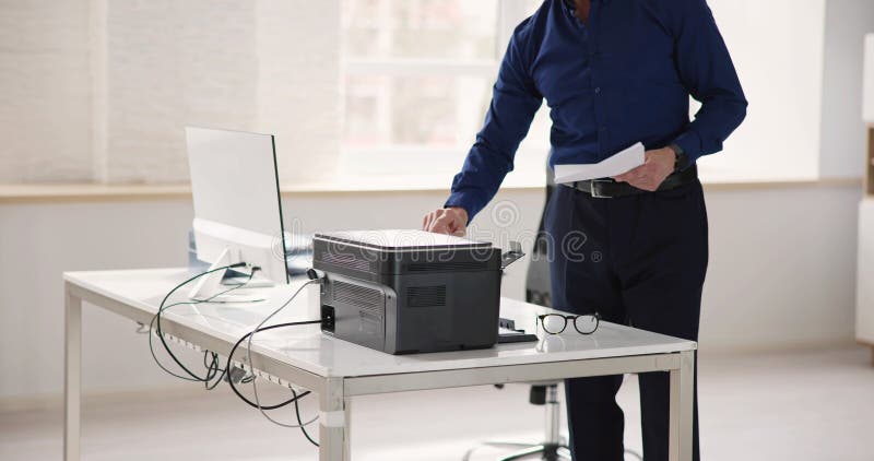 Man Using Photocopy Machine in Office Stock Photo - Image of standing ...