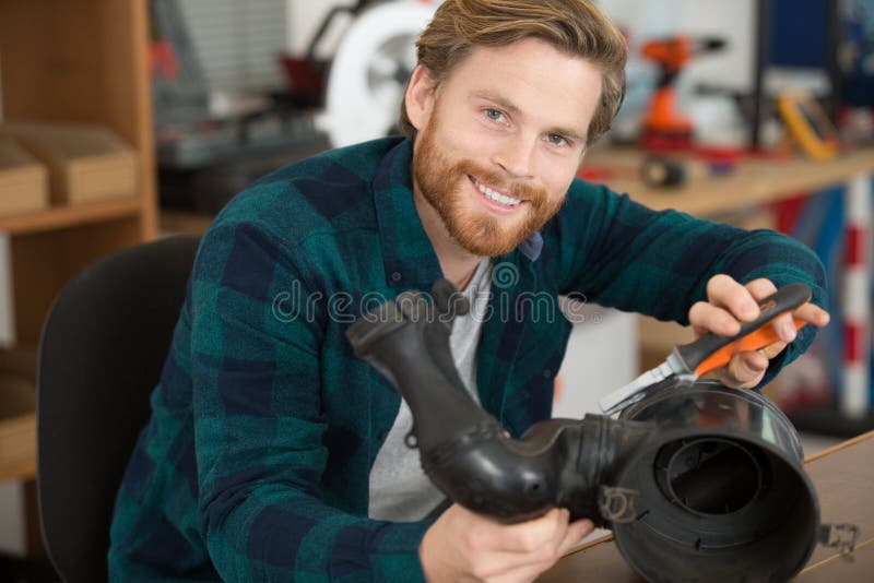 Man Using Pipe Wrench Smiling at Camera Stock Image - Image of tool ...