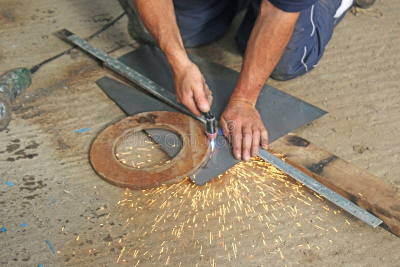 Man using a plasma cutter stock photo. Image of work - 176067254