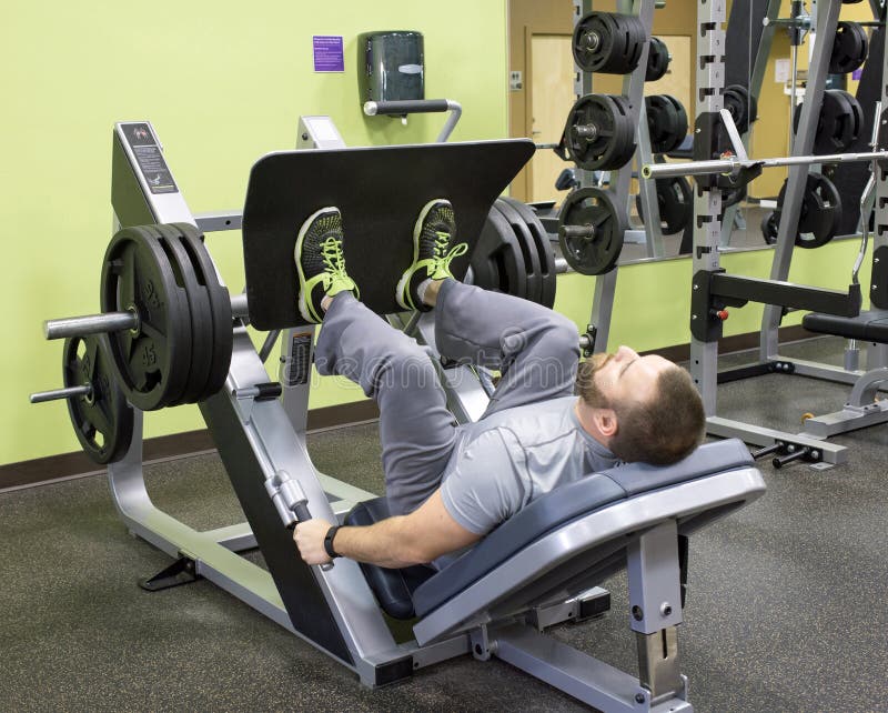Man Using Plate Loaded Leg Press Stock Photos - Free & Royalty-Free ...