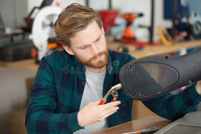 Man Using Pliers in Workshop Stock Photo - Image of industry, adult ...