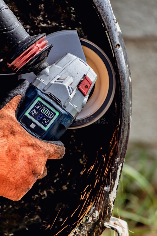 Man Using Portable Grinder with Sparkles Stock Image - Image of spark ...