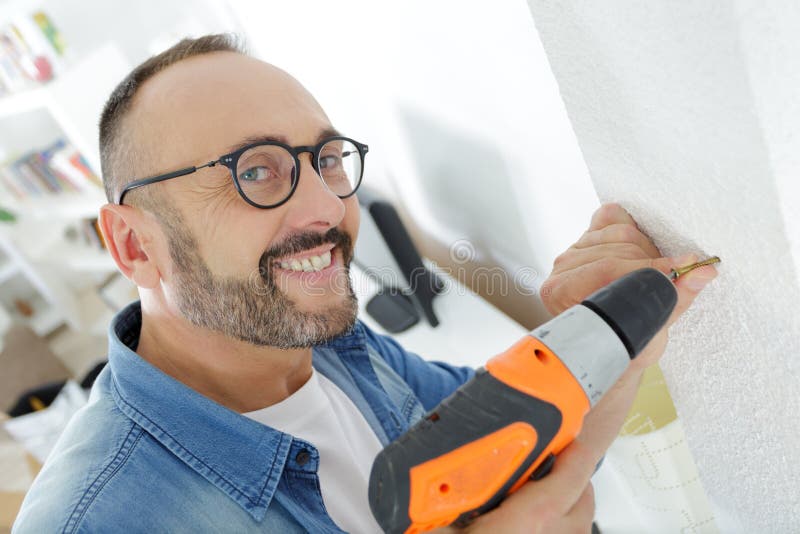 Man Using Power Drill at Home Stock Image - Image of bricolage, masonry ...