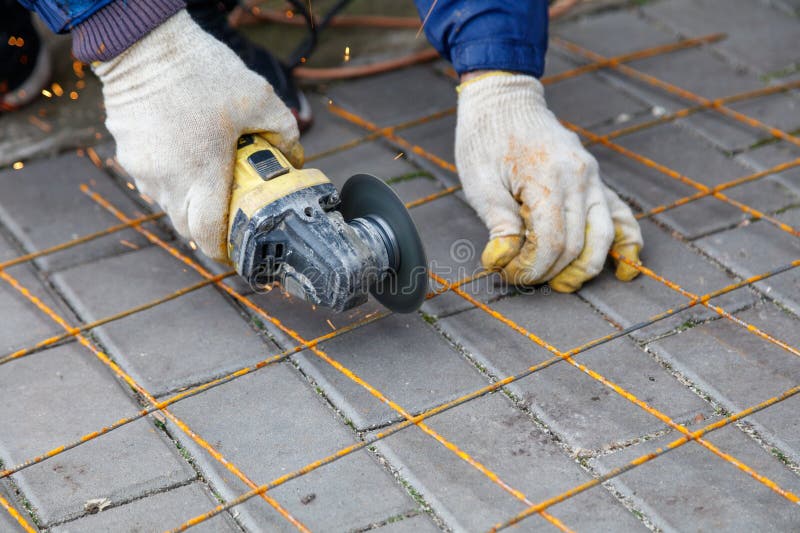 A Man is Using a Power Tool To Cut a Metal Grid Stock Image - Image of ...