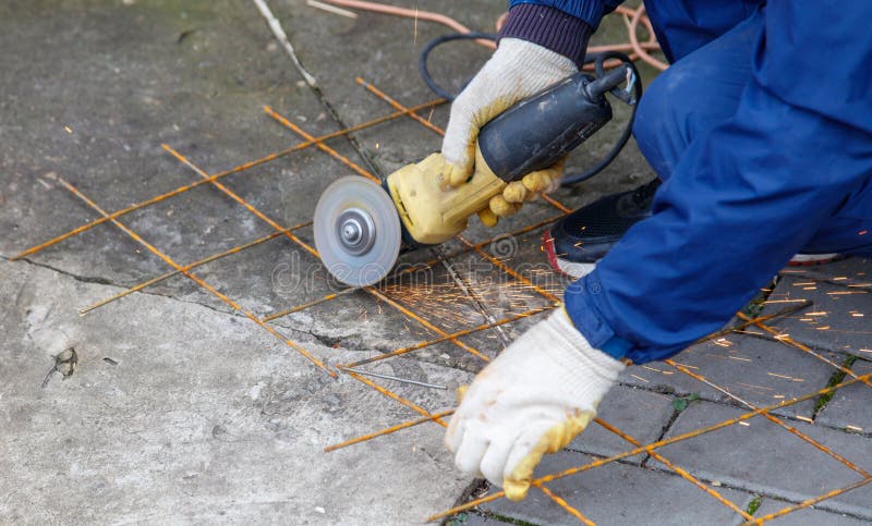 A Man is Using a Power Tool To Cut a Metal Grid Stock Photo - Image of ...