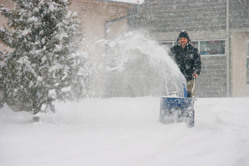 Man Using a Powerful Snow Blower Stock Image - Image of snowing, frozen ...