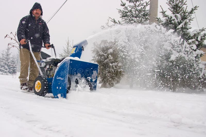 Man Using a Snow Blower stock image. Image of thrower - 7375311
