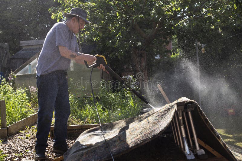 Man Using a Pressure Washer Stock Image - Image of jetwashing, clothing ...