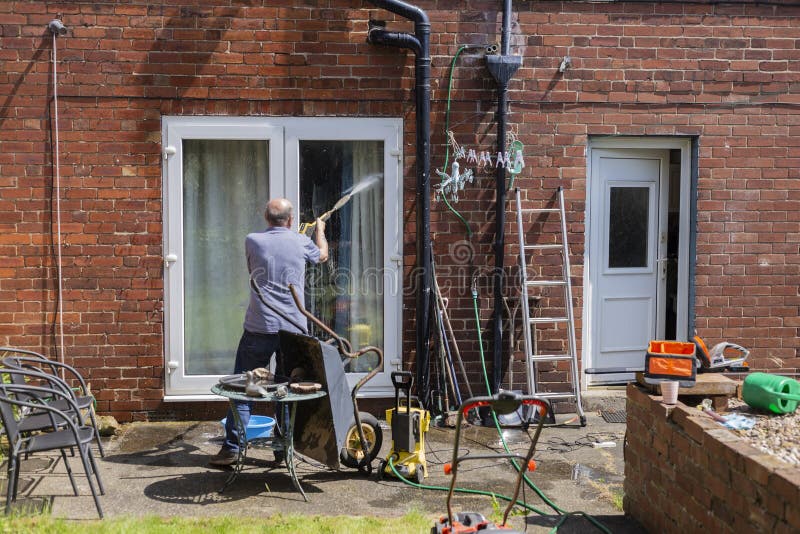 Man Using a Pressure Washer Stock Image - Image of stream, stonewall ...