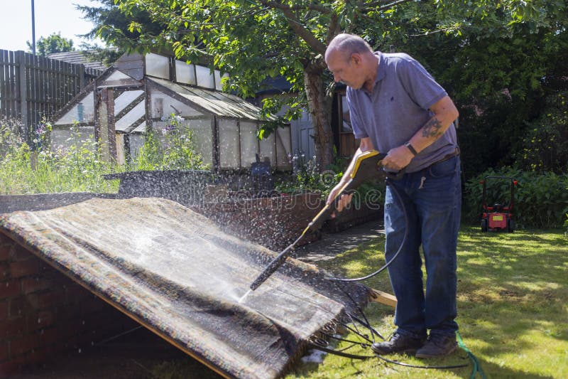 Man Using a Pressure Washer Stock Photo - Image of spray, pressure ...