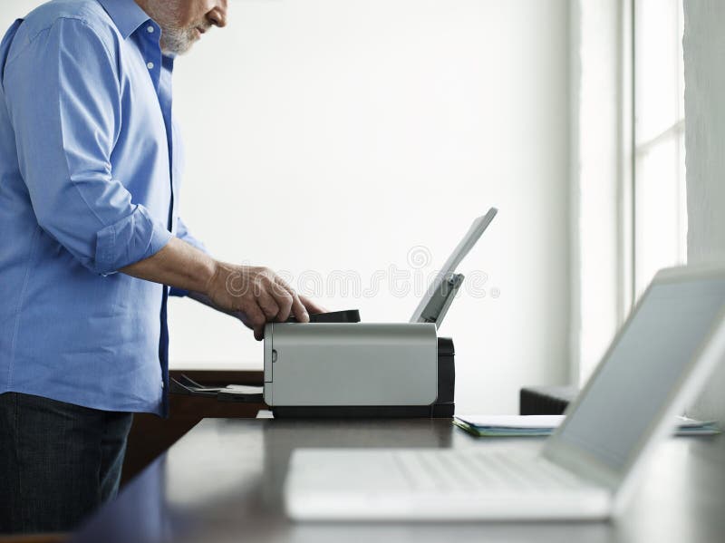 Man Using Printer at Study Table in House Stock Photo - Image of people ...