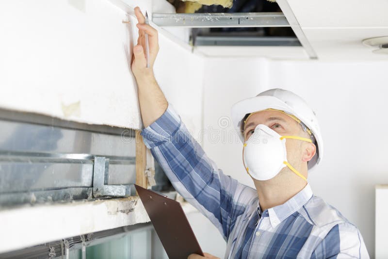 Man Using Protective Mask Working on Ceiling Stock Image - Image of ...