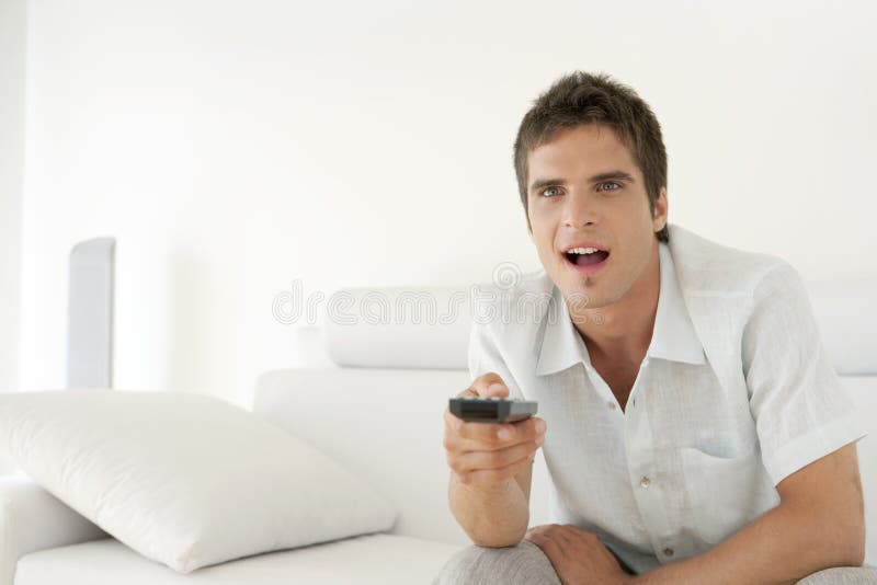 Man Using a Remote Control stock photo. Image of design - 24787316