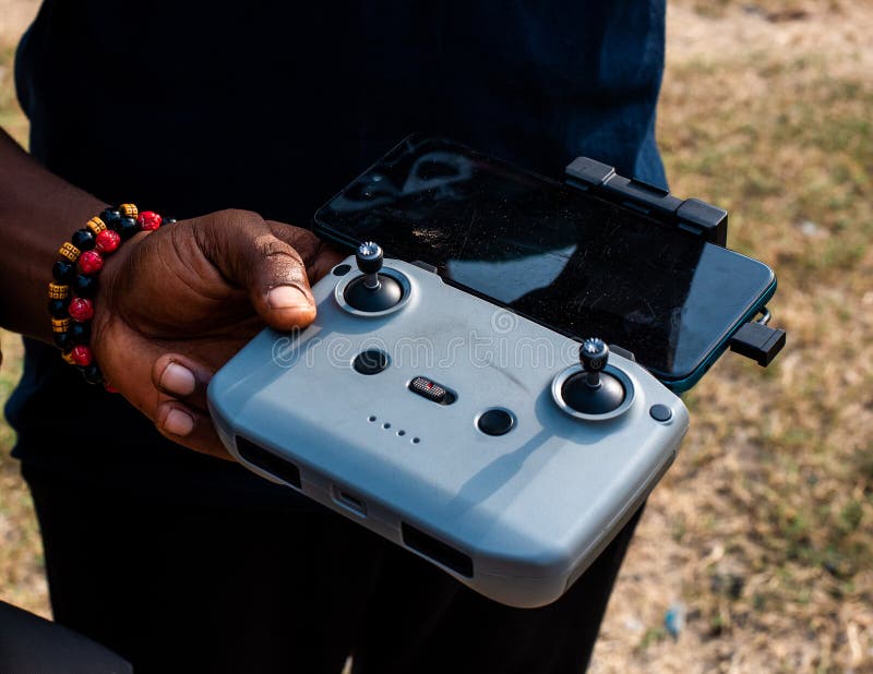 A Man Using a Remote Control To Fly a Drone Stock Image - Image of ...
