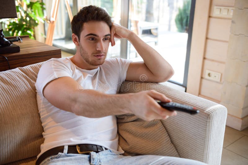 Man Using Remote Controller Stock Photo - Image of program, livingroom ...