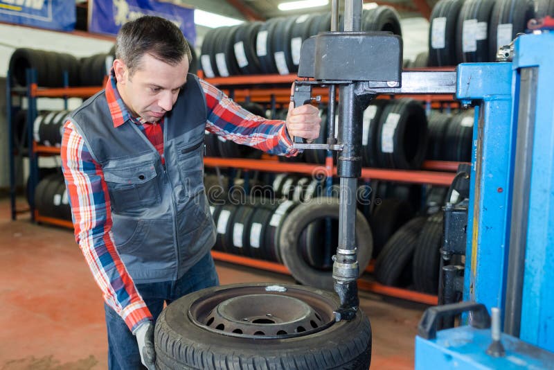 Man Using Removing Tyre from Wheel Stock Photo - Image of problem ...