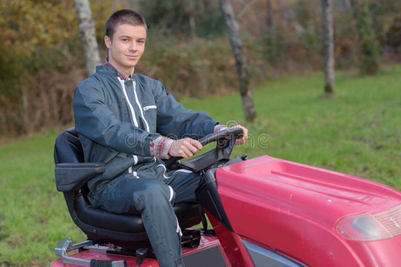 Man on ride on mower stock photo. Image of gardening - 115128390