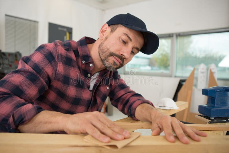 Man Using Sandpaper on Wood Window Frame Stock Photo - Image of ...