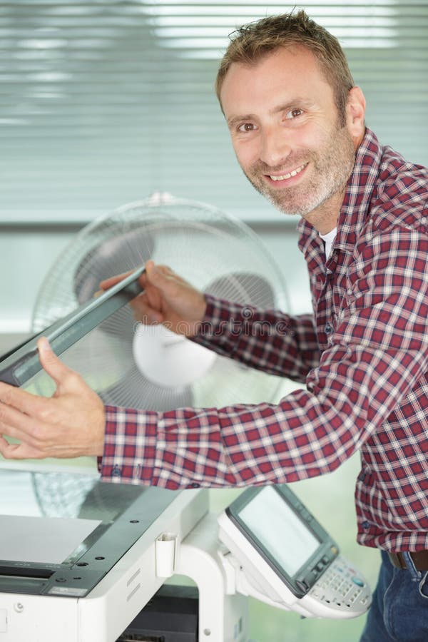 Man Using Scanner Multifunction Device in Office Stock Image - Image of ...