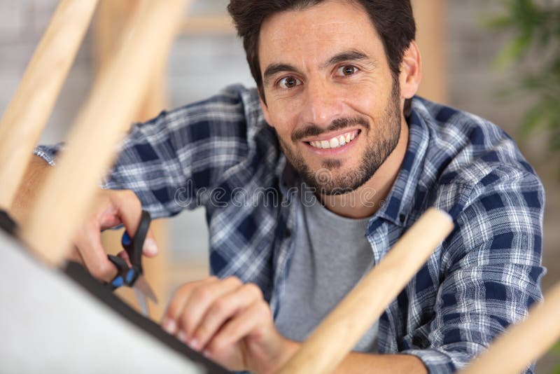 Man Using Scissors To Work on Chairs Upholstery Stock Photo - Image of ...